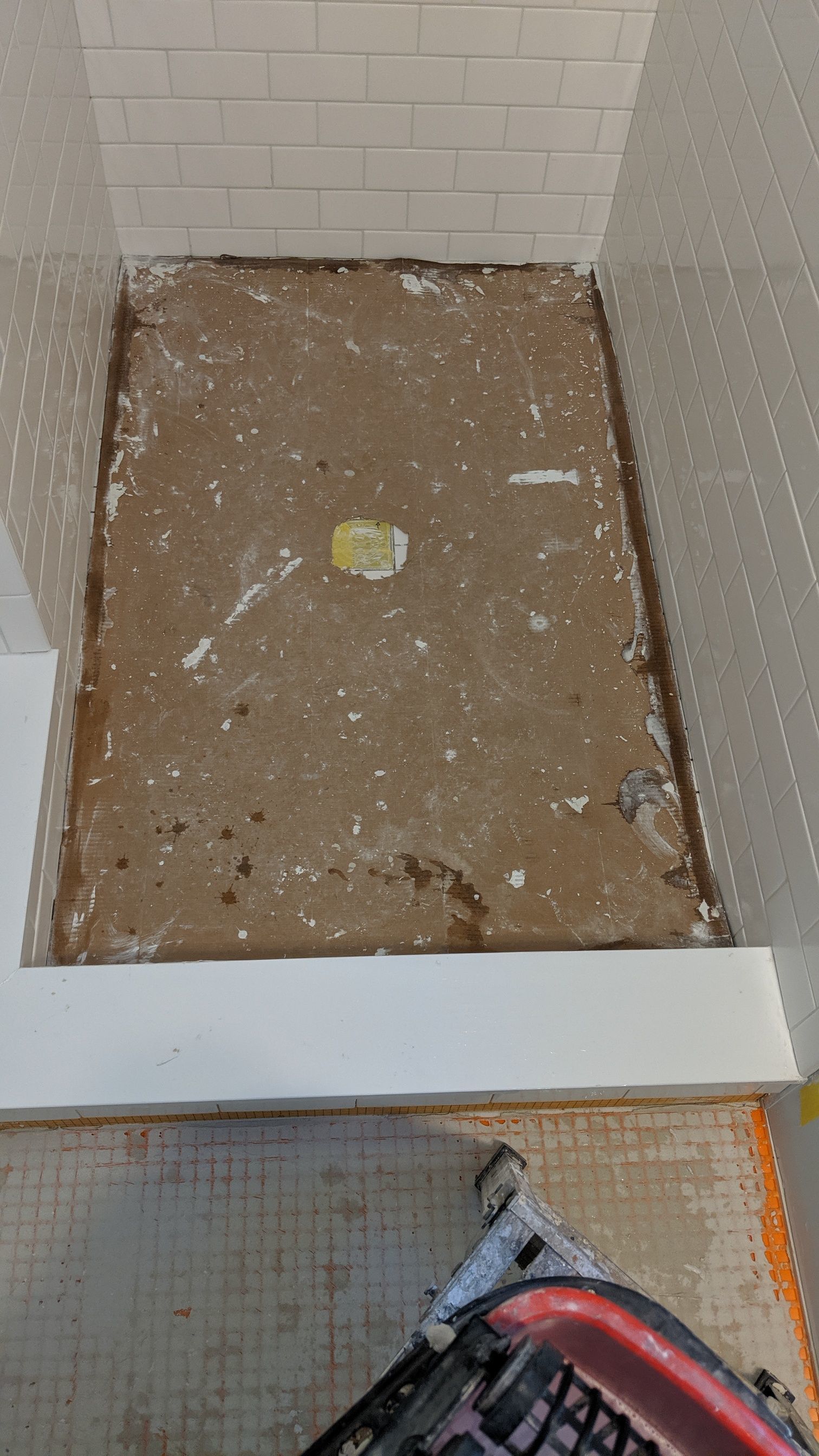 Protect the preformed shower pan - Fine Homebuilding