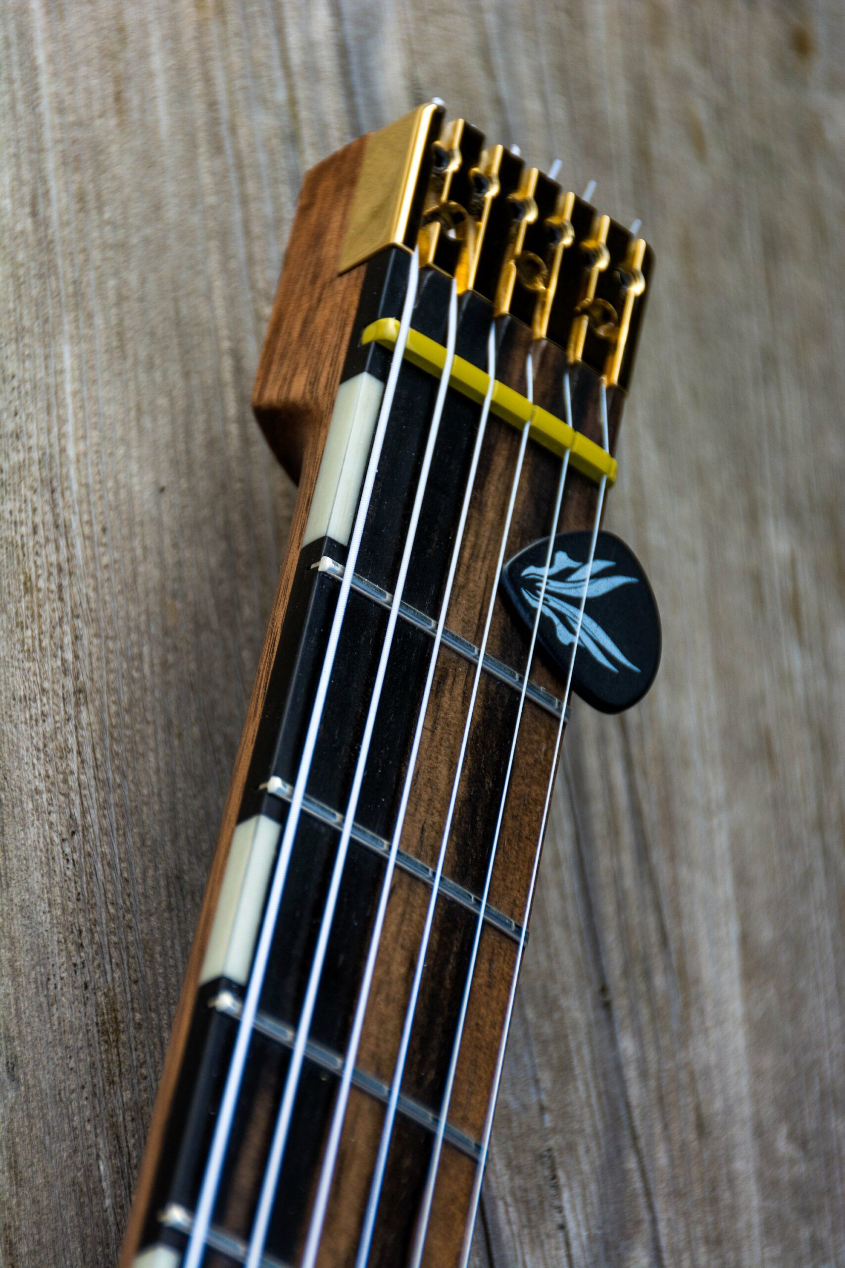 Hufschmid 6 string headless guitar! - FineWoodworking