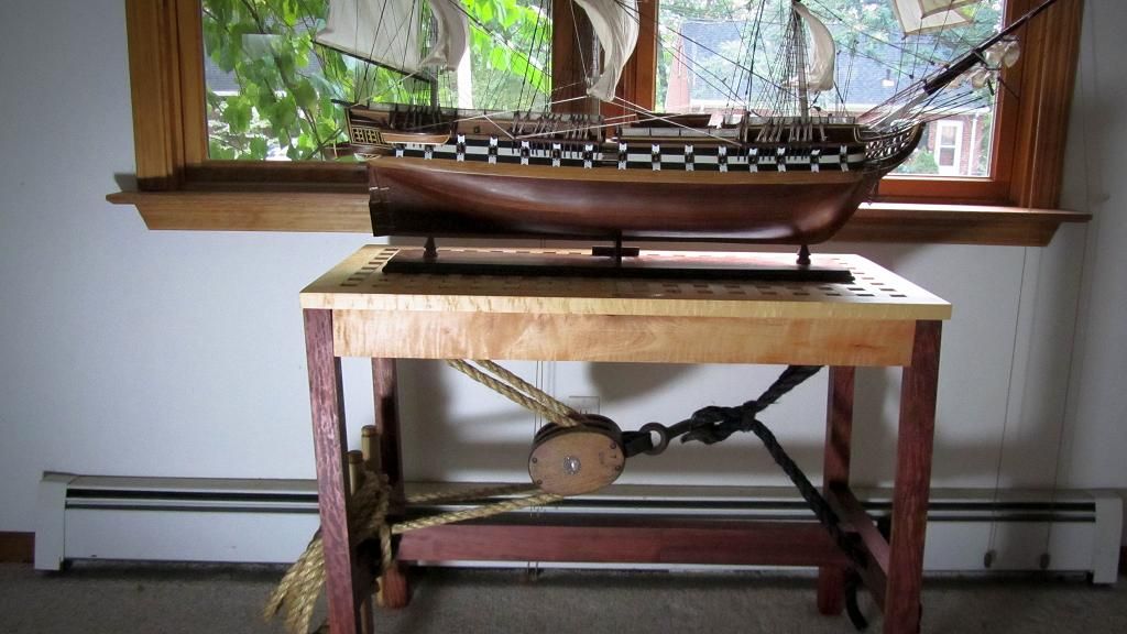 A nautical themed table to hold a ship model. - FineWoodworking