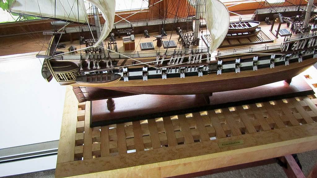 A nautical themed table to hold a ship model. - FineWoodworking