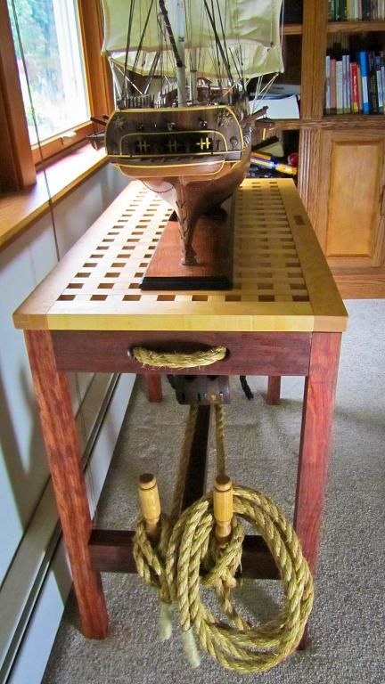 A nautical themed table to hold a ship model. - FineWoodworking