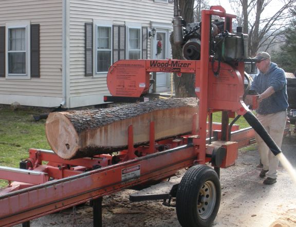 Portable mill sawing up a local Cherry tree - FineWoodworking